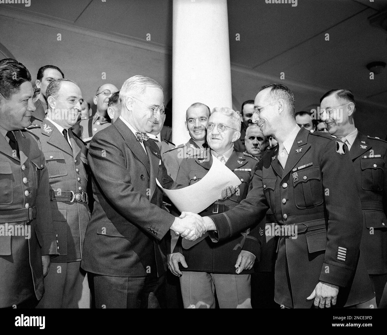 President Harry S. Truman shakes hands with Lt. Col. Miguel Burset, of ...