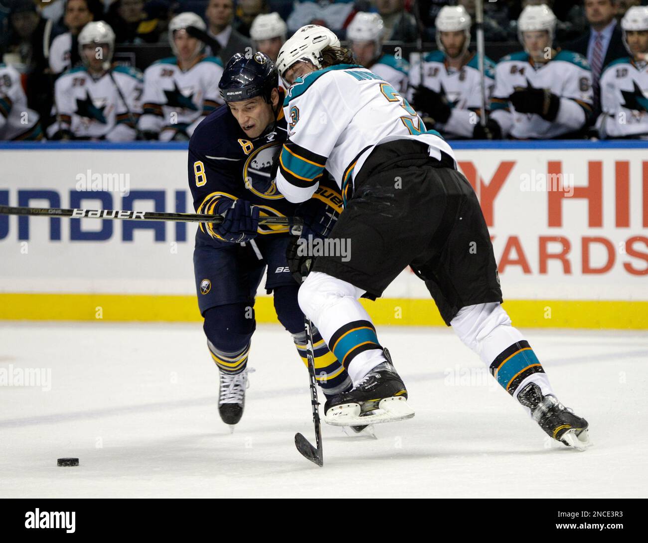 Buffalo Sabres' Cody McCormick (8) battles for the puck with San Jose ...