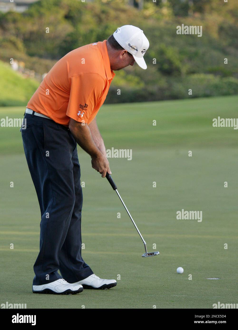Robert Garrigus looks on while missing a three-foot putt on the second ...