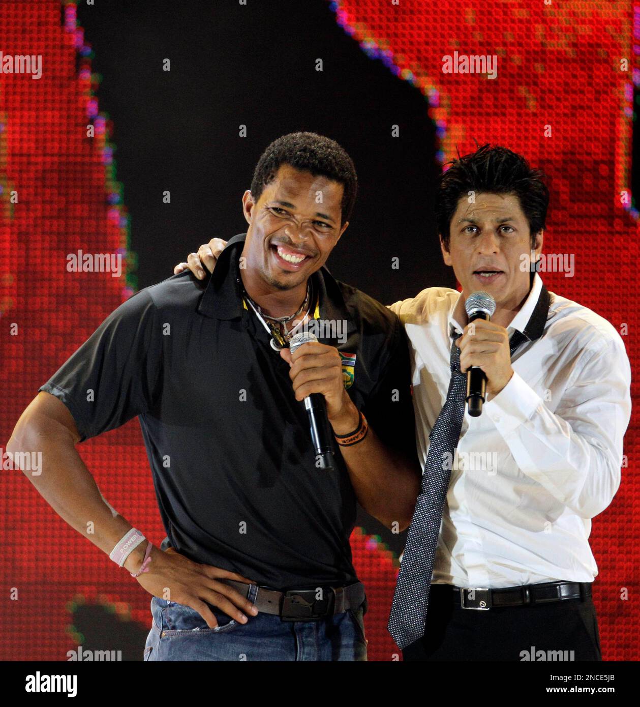 India's film actors Shahrukh Khan, right, presents South Africa's ...