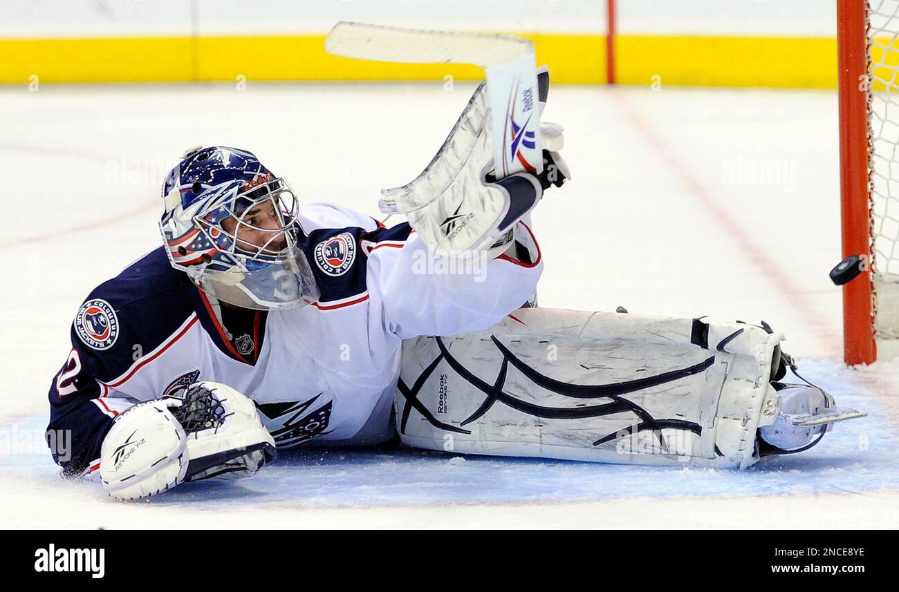 Columbus Blue Jackets goalie Mathieu Garon is scored on by Los Angeles ...