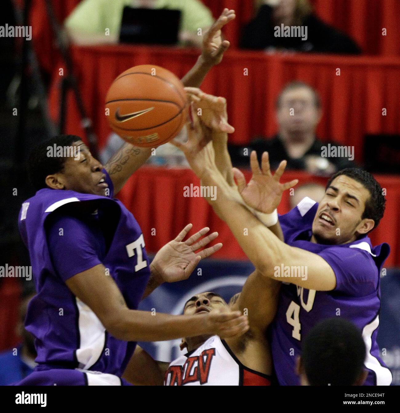 TCU's Jarvis Ray, left, and Amric Fields, right, battle for a rebound ...