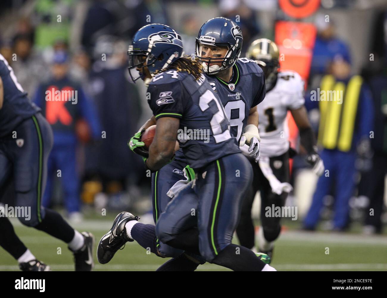 Seattle Seahawks Matt Hasselbeck hands off to Marshawn Lynch in the ...