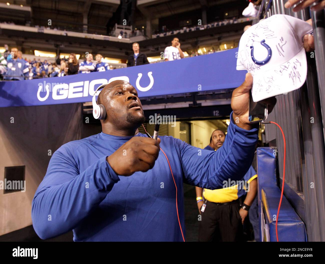 Indianapolis Colts defensive tackle Eric Foster (68) signs autographs ...