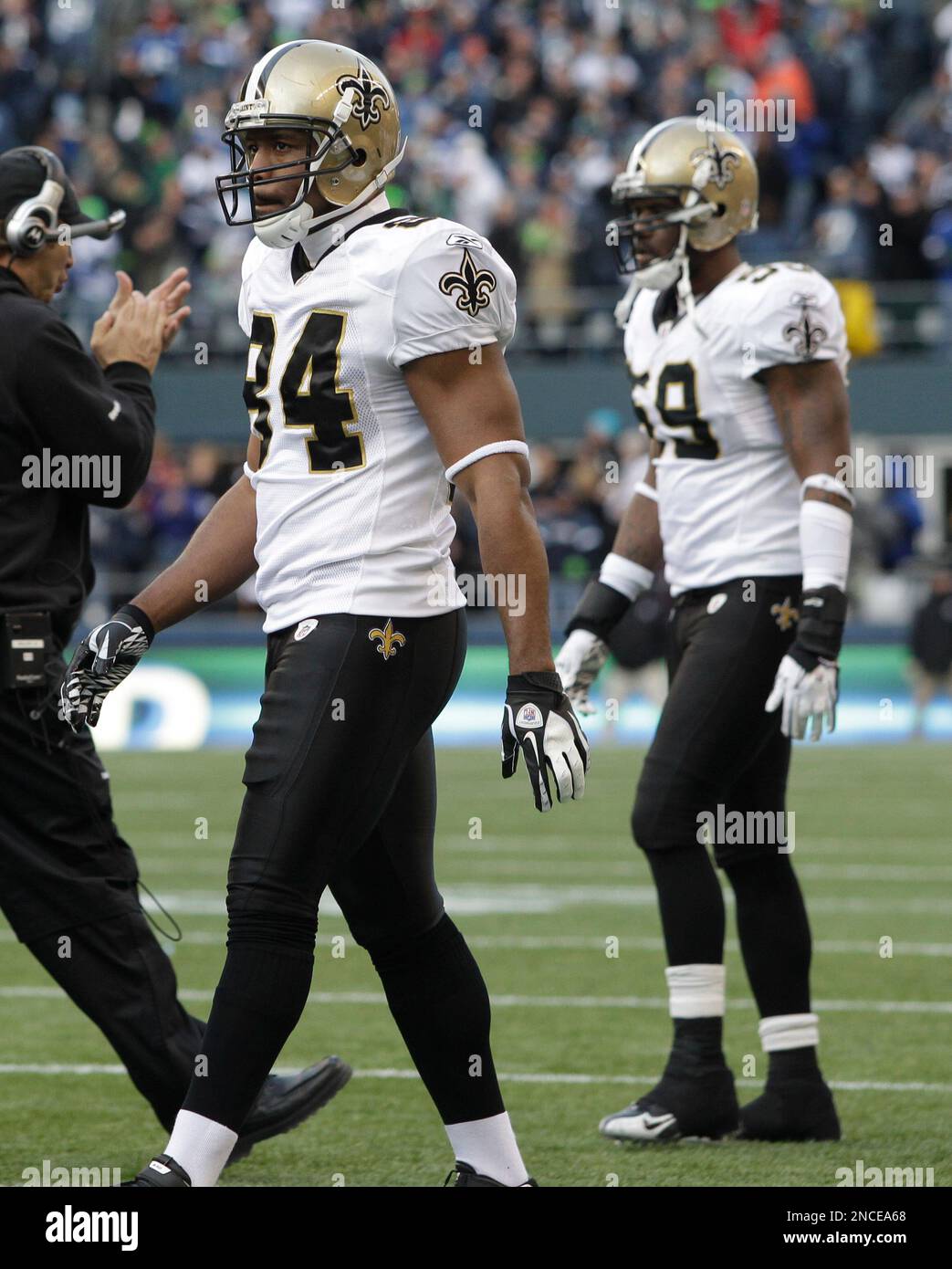 New Orleans Saints' Patrick Robinson (34) and Anthony Waters (59) walk ...