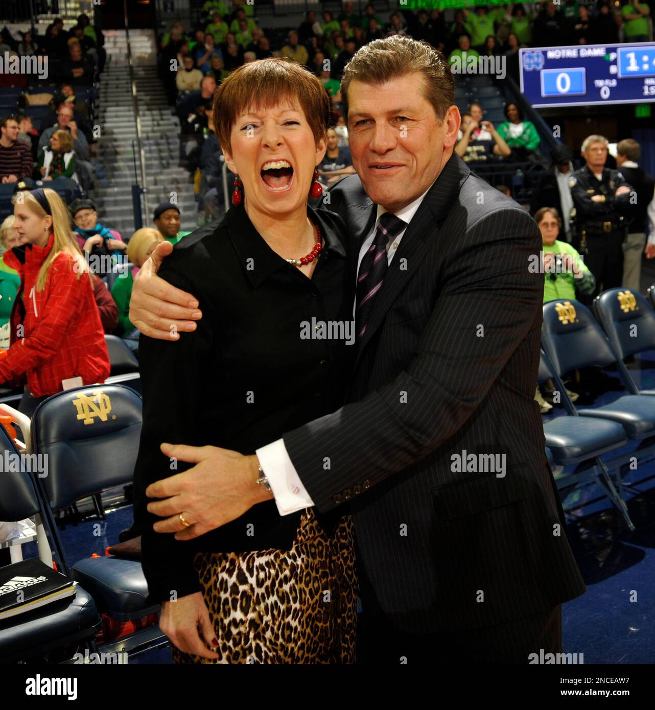 Notre Dame coach Muffet McGraw, left, gets a hug from Connecticut coach ...