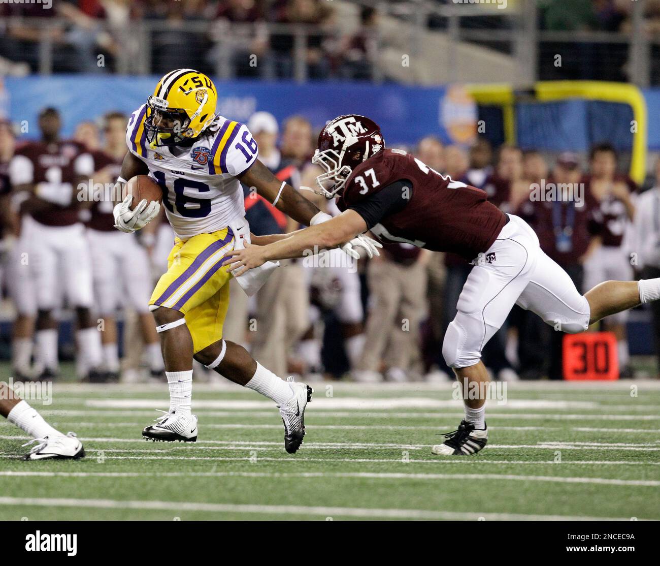 LSU running back Spencer Ware and Texas A&M linebacker Michael Hodges ...