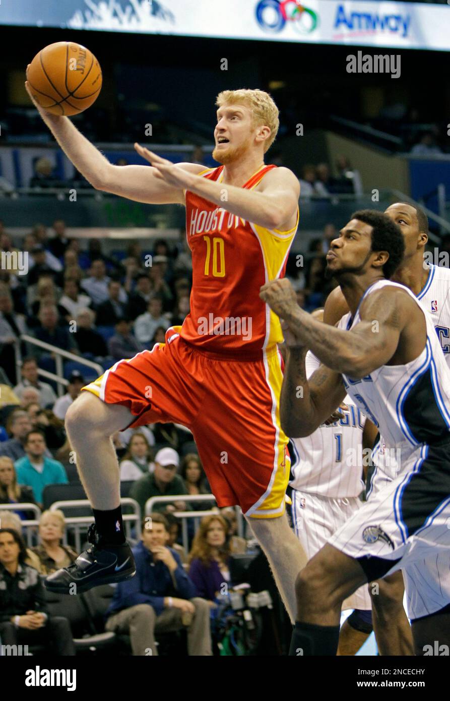 Houston Rockets' Chase Budinger (10) goes in for a basket past Orlando ...