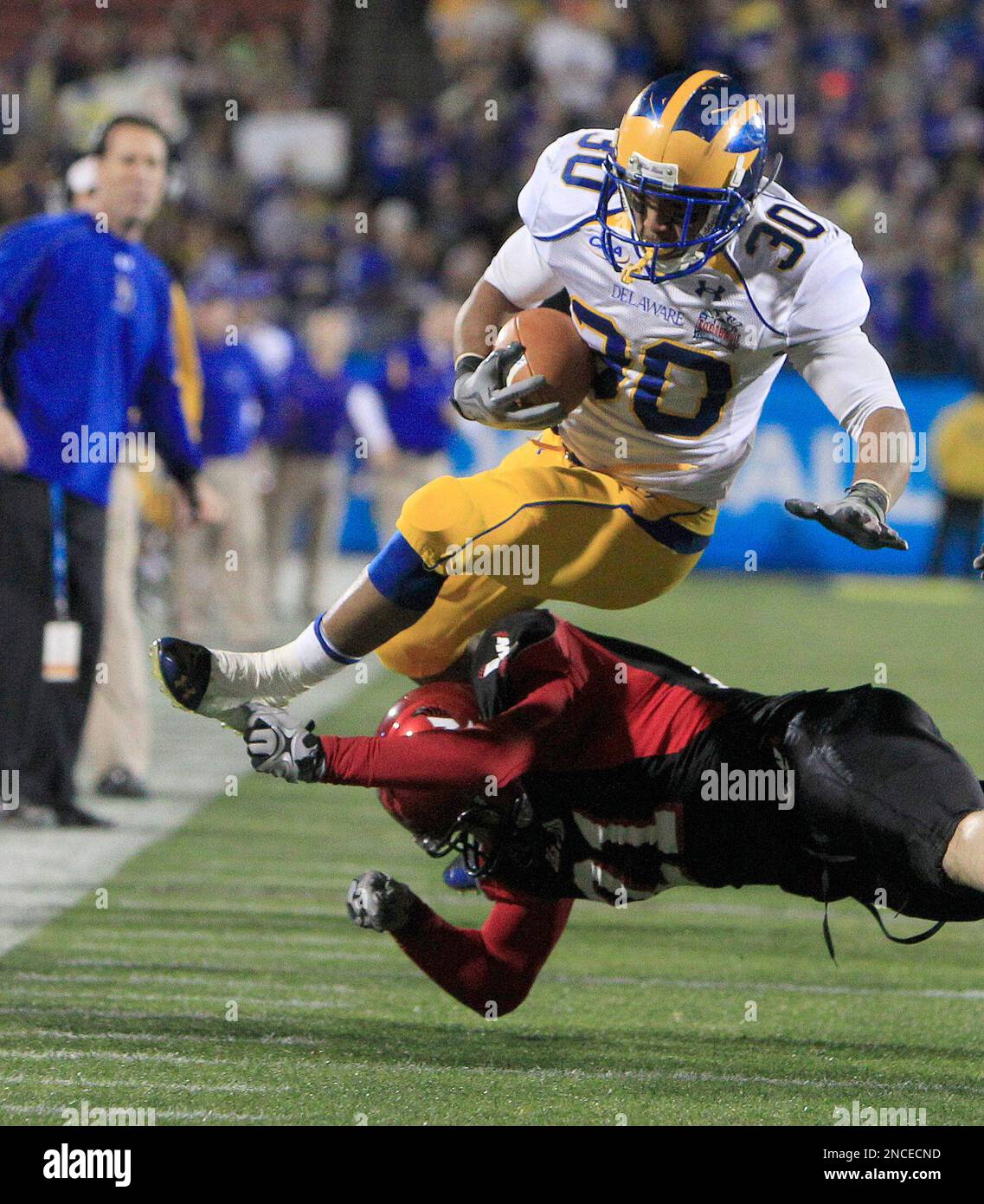Delaware running back Andrew Pierce (30) jumps over Eastern Washington ...