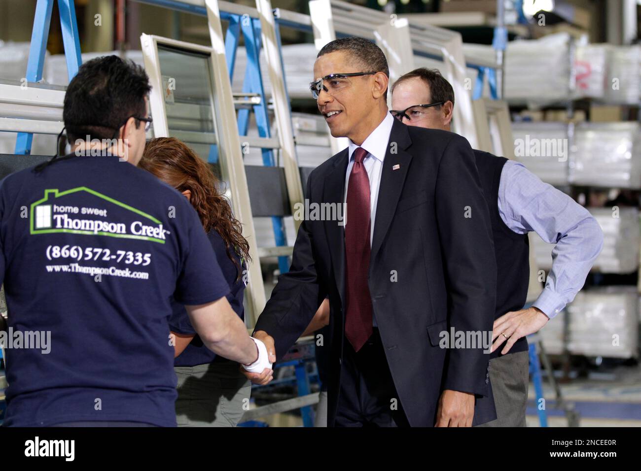 President Barack Obama, accompanied by Thompson Creek Window Company ...