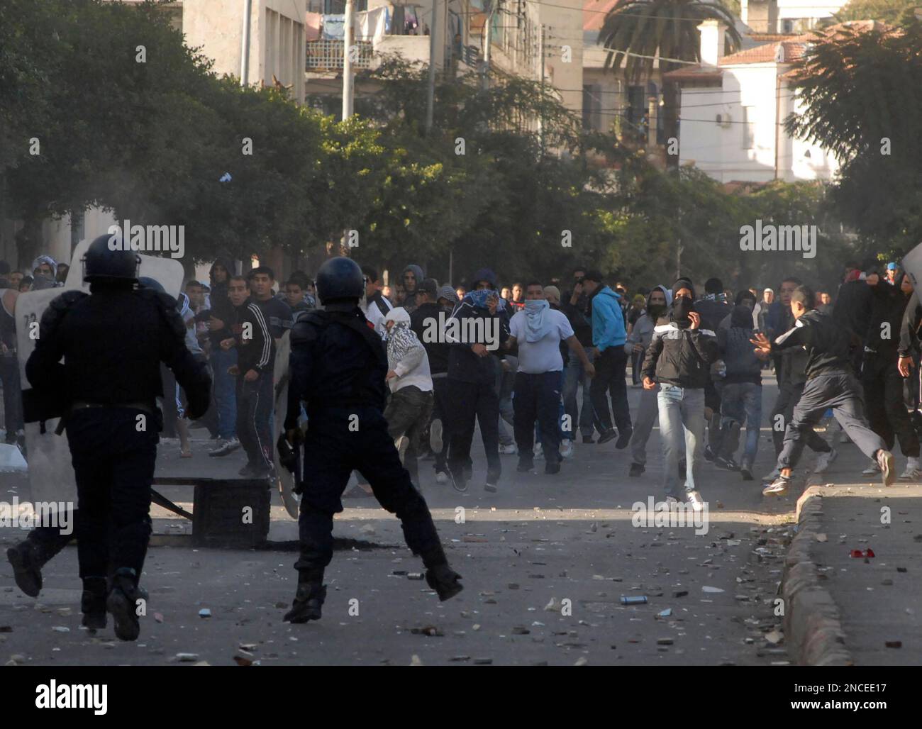 Youth face police forces in the Belcourt district of Algiers, Friday ...