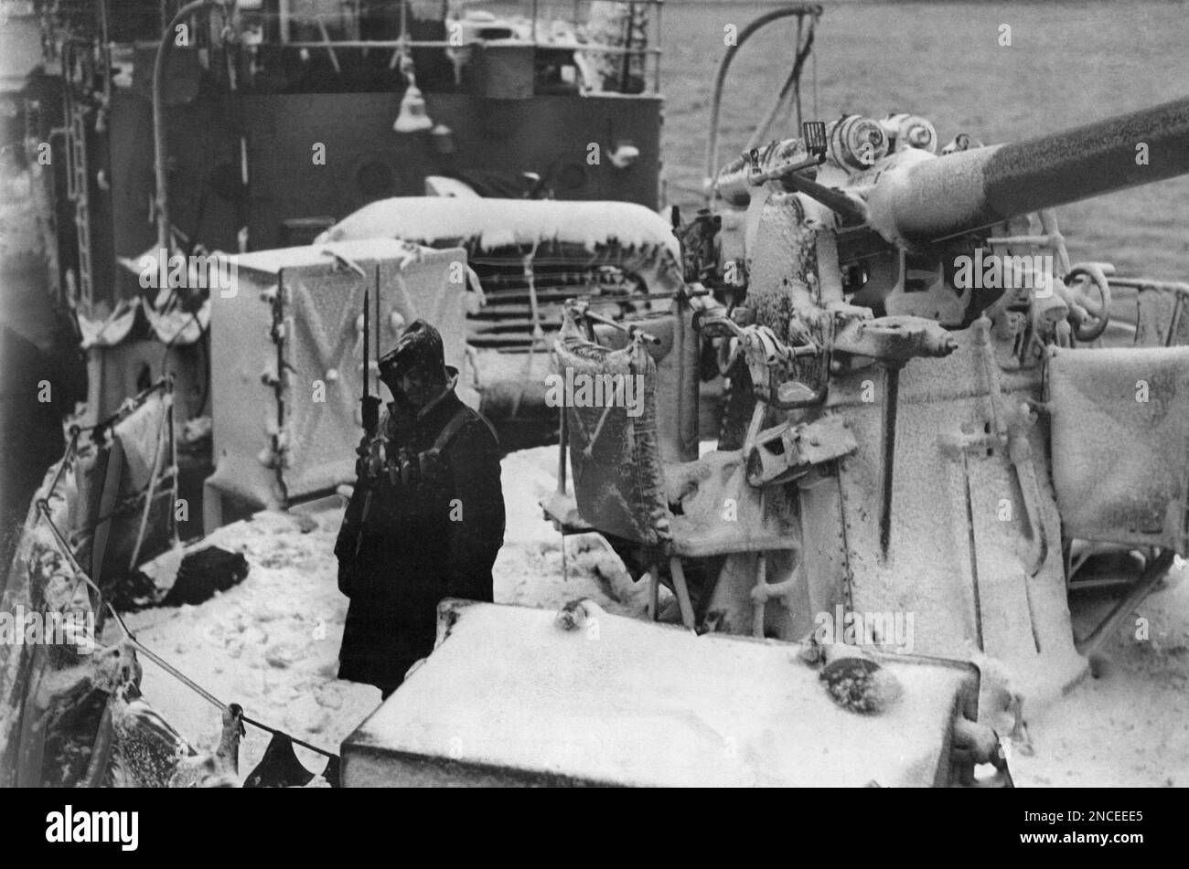 Wintry blasts envelope this British warship in a coating of ice and ...