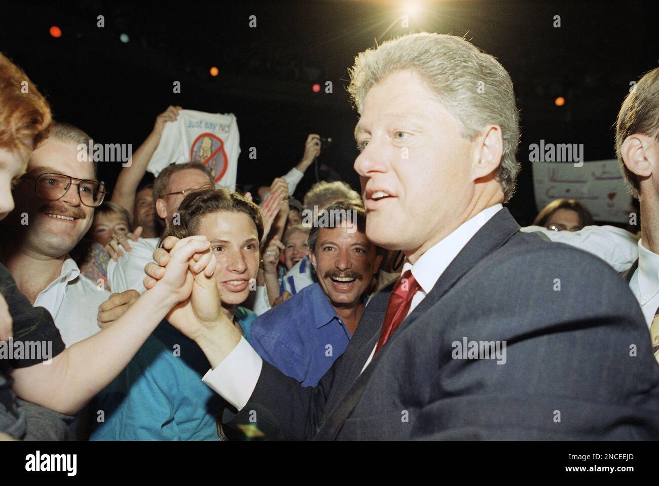 Democratic presidential nominee Bill Clinton greets an enthusiastic ...