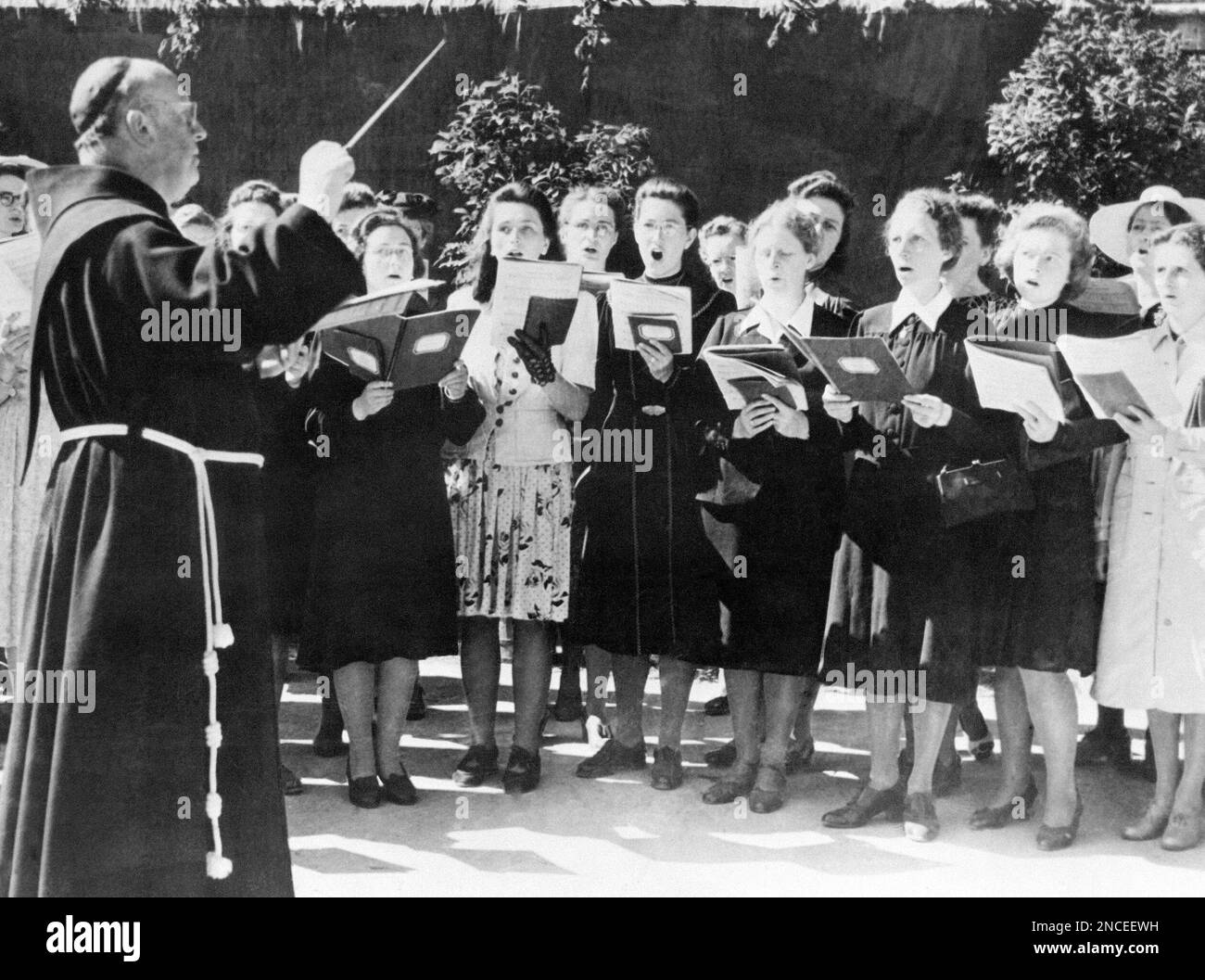 Under the direction of a German Catholic priest, a choir of Munich ...