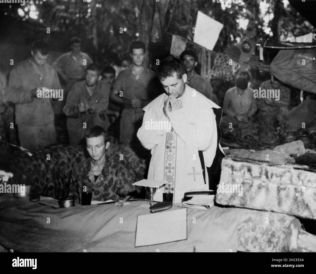 Navy Chaplain George M. Kempker, of West Point, Neb., celebrates Mass ...