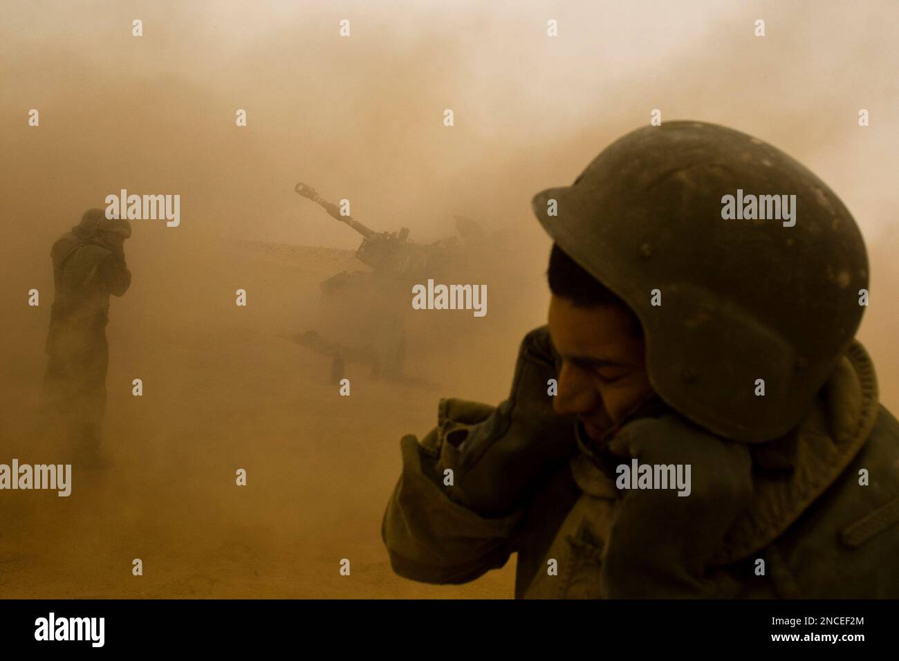 In this Dec. 29, 2010 photo, Israeli soldiers cover their ears as a ...