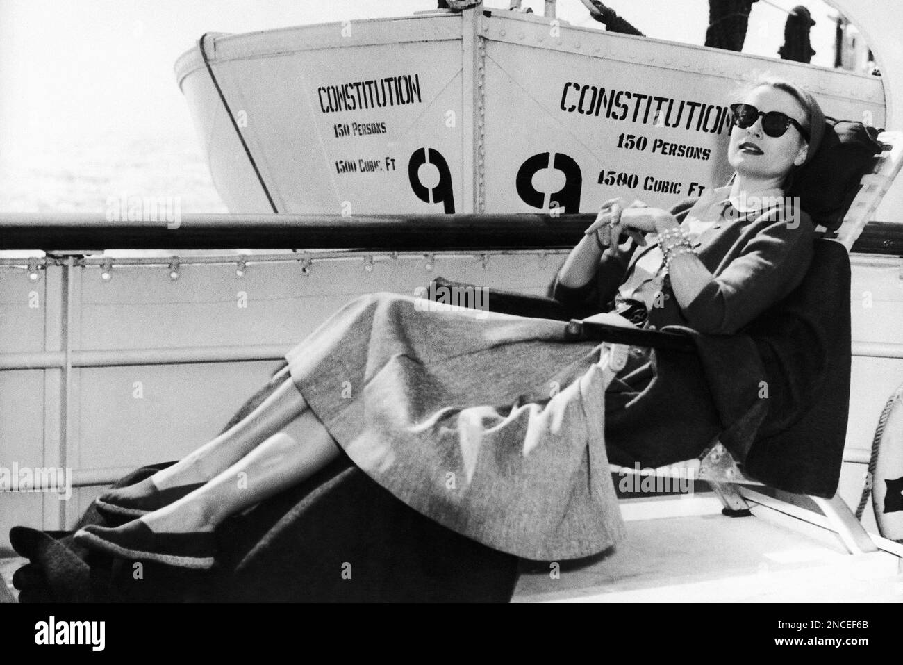 Actress Grace Kelly takes the sun on a deck of the SS Constitution, on ...