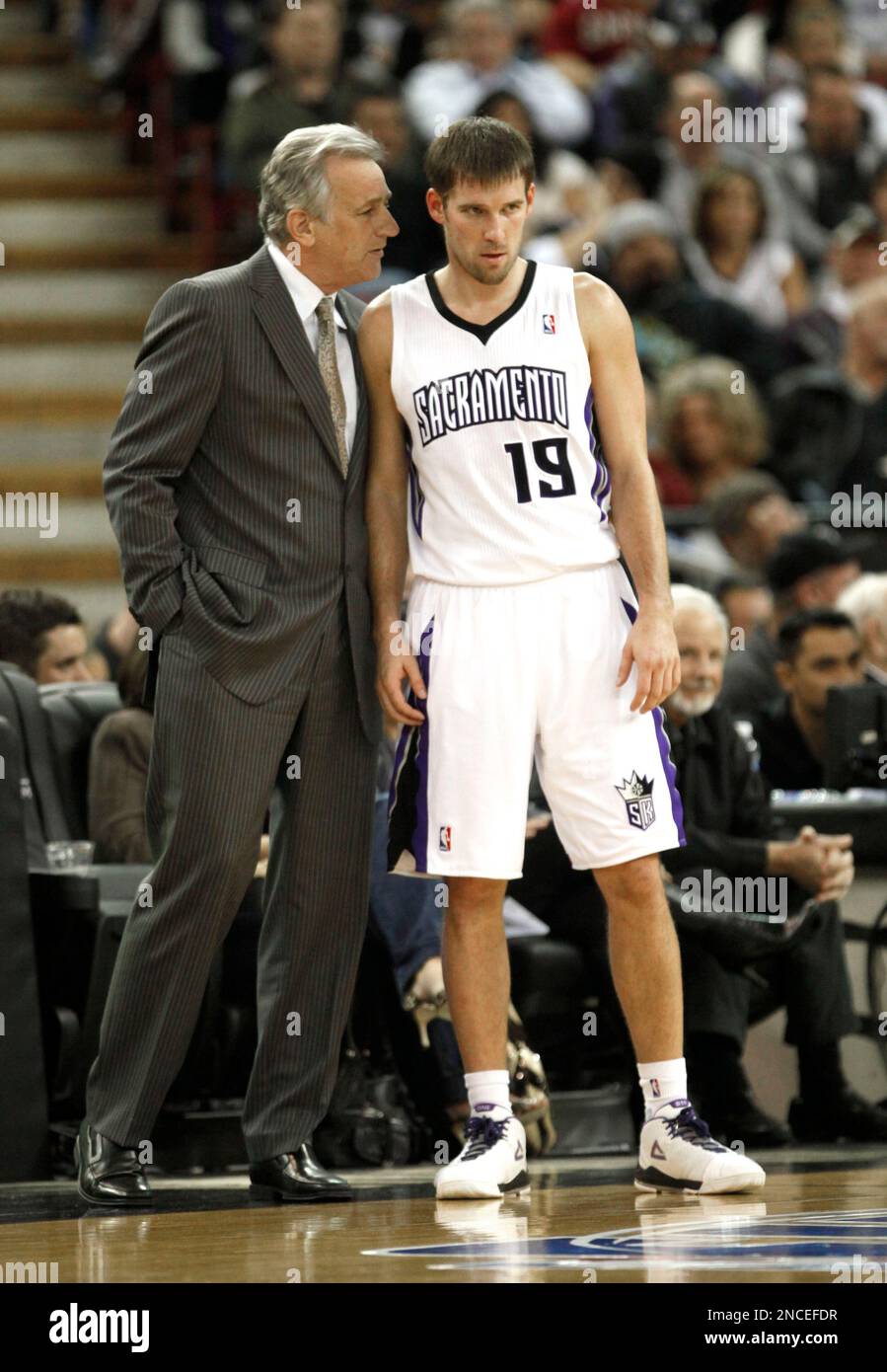 Sacramento Kings head coach Paul Westphal, left, talks with Kings guard ...