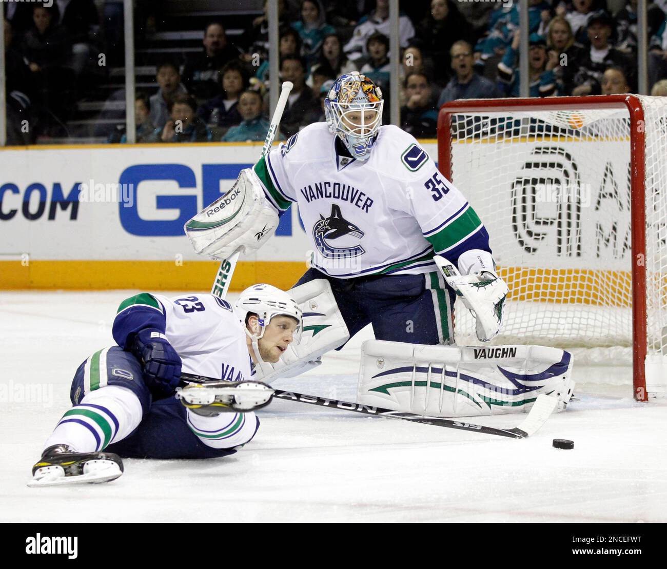 Vancouver Canucks goalie Cory Schneider (35) and defenseman Alexander ...