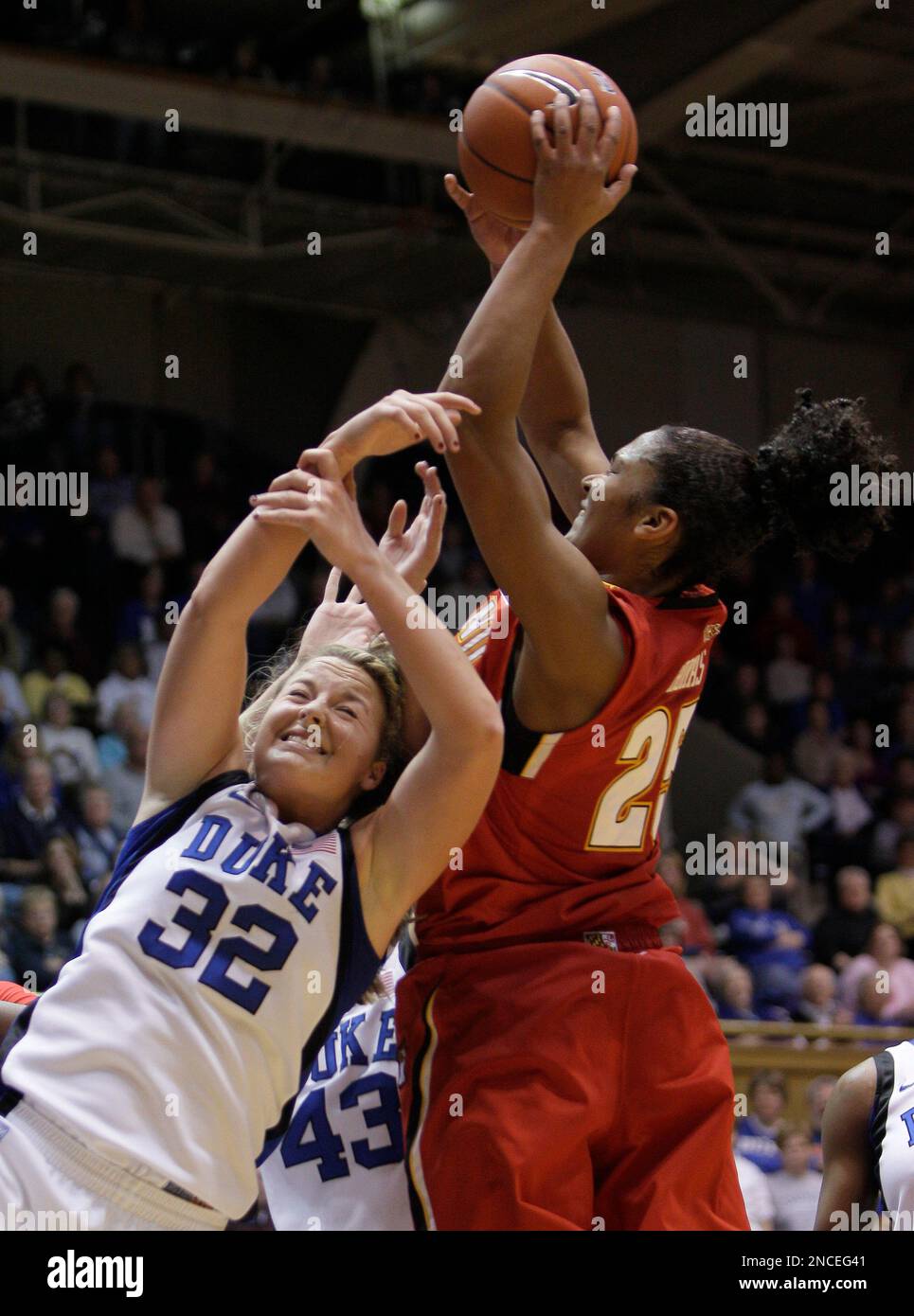 Duke's Tricia Liston (32) and Maryland's Alyssa Thomas (25) reach for a ...