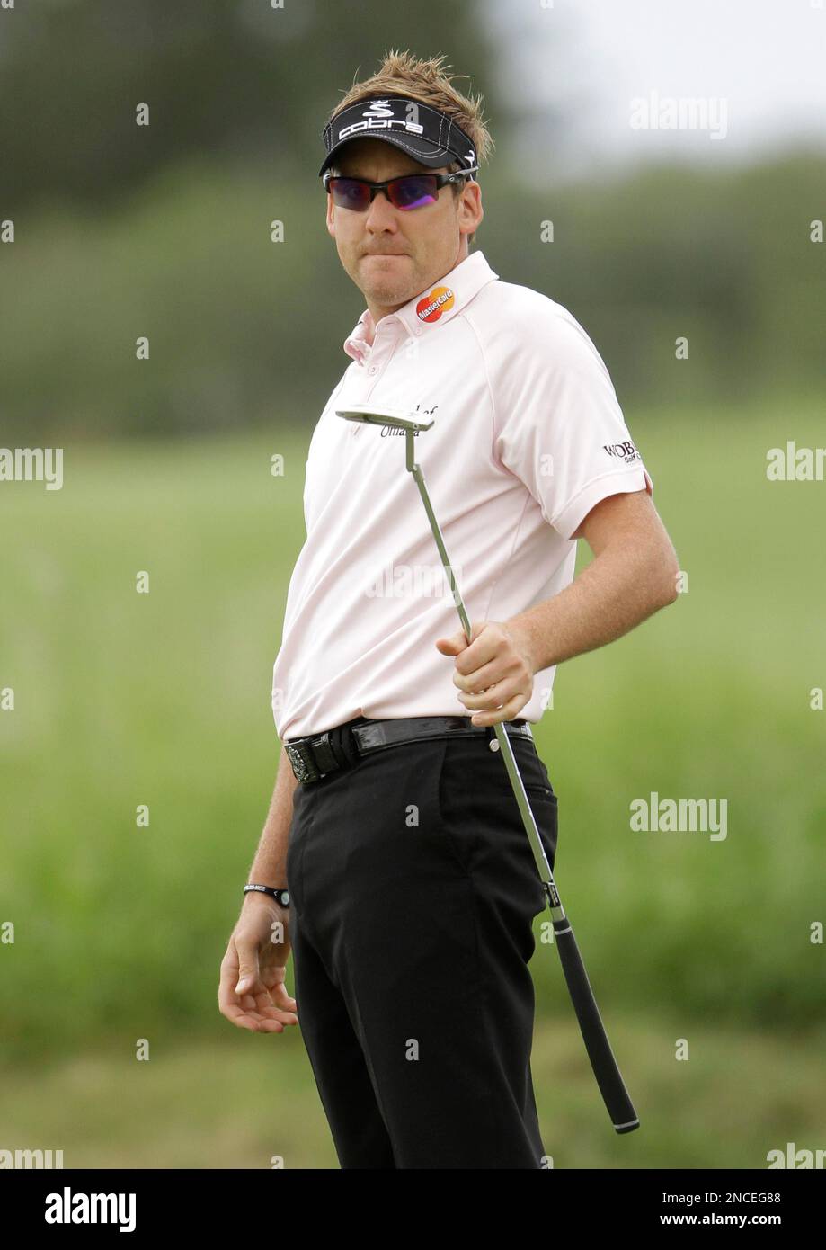 Ian Poulter reacts after missing an eagle putt on the ninth green ...