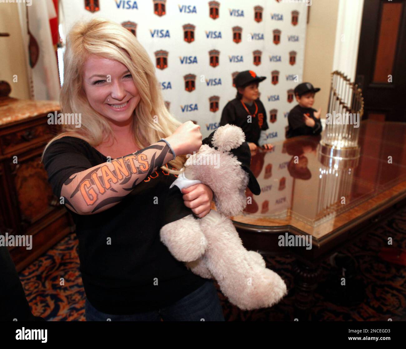 San Francisco Giants fan Lauren Ruffo, displays her Giant's sleeve and ...