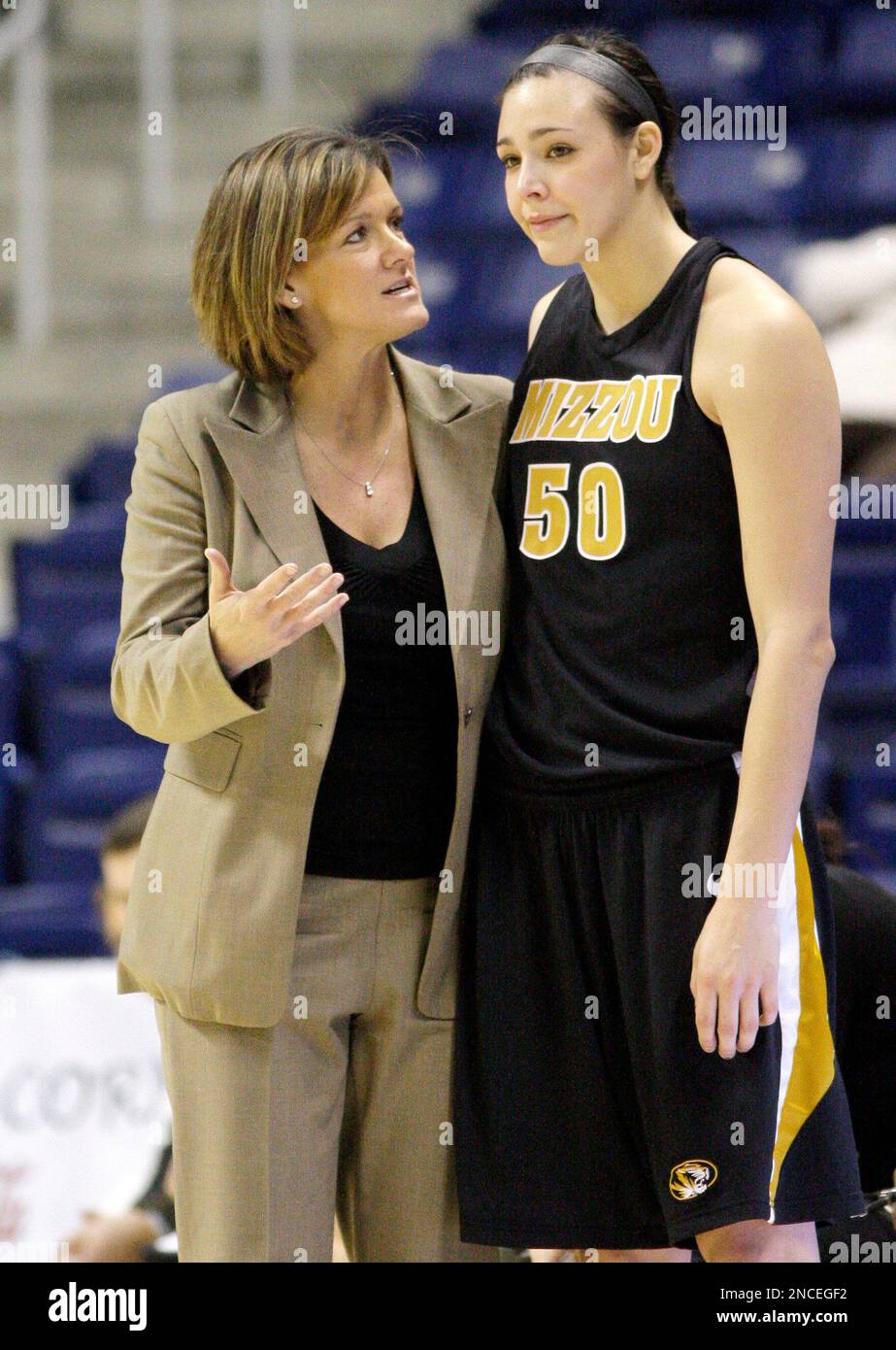 Missouri head coach Robin Pingeton talks with forward Christine Flores ...