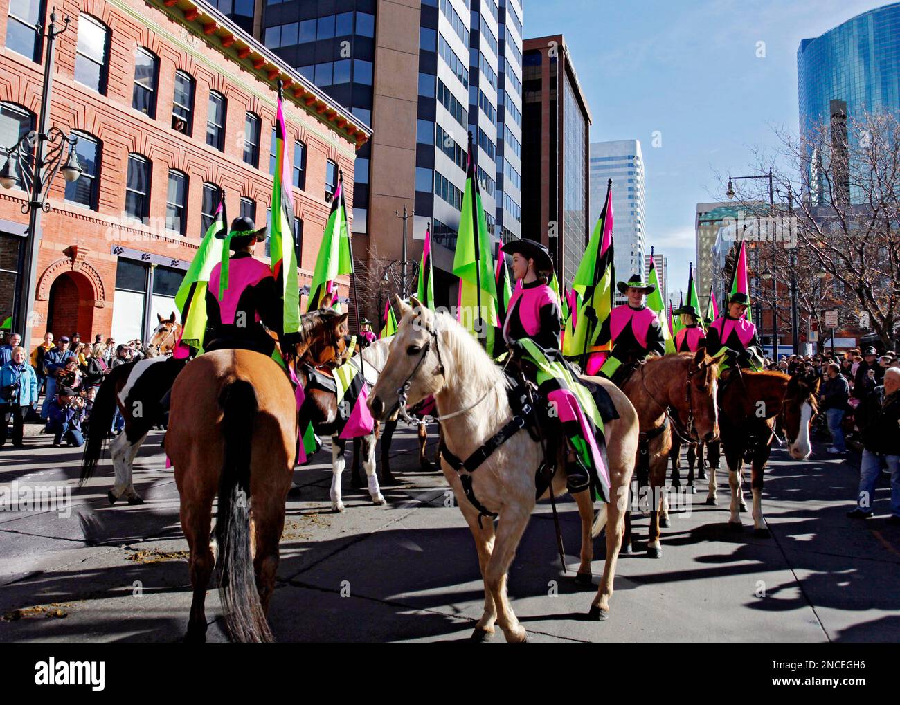 The Westernaires ride down 17th Street in the kickoff parade for the ...