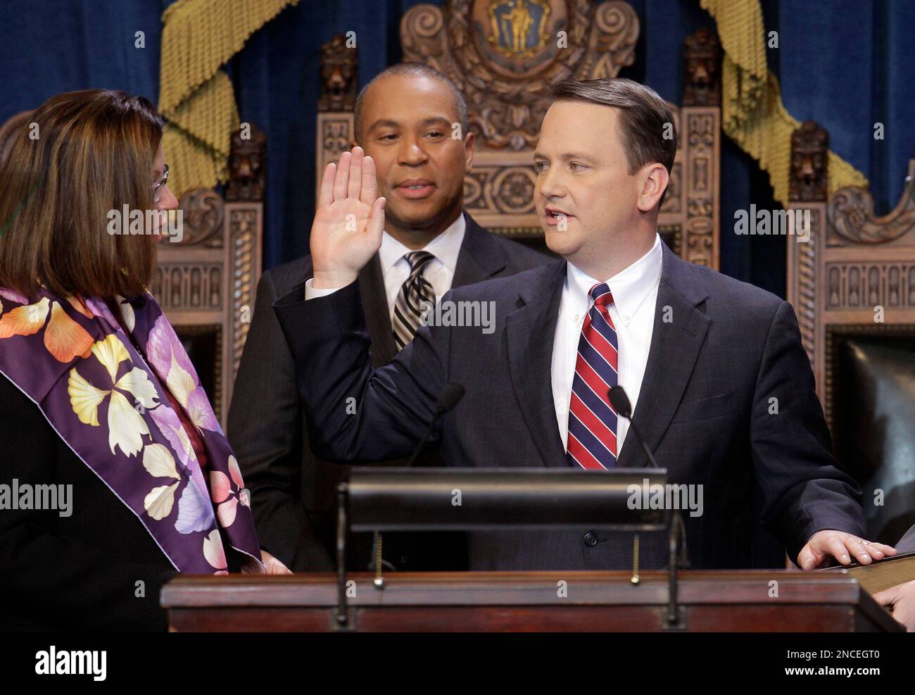 Newly re-elected Lt. Gov. Tim Murray, right, is administered the oath ...