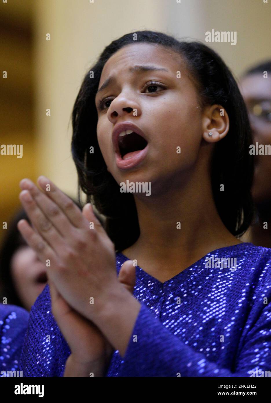 Alivia Croxton, a member of the Voices of Unity Youth Choir, performs ...