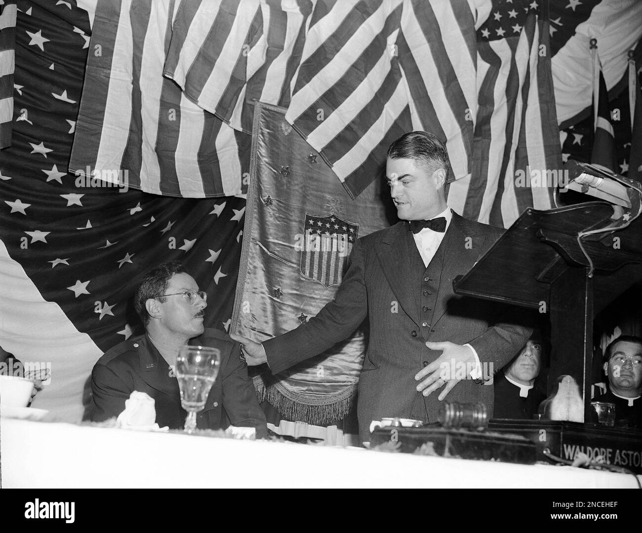 Alan Gould speaks and gives AP photographer Joe Rosenthal a pat on ...