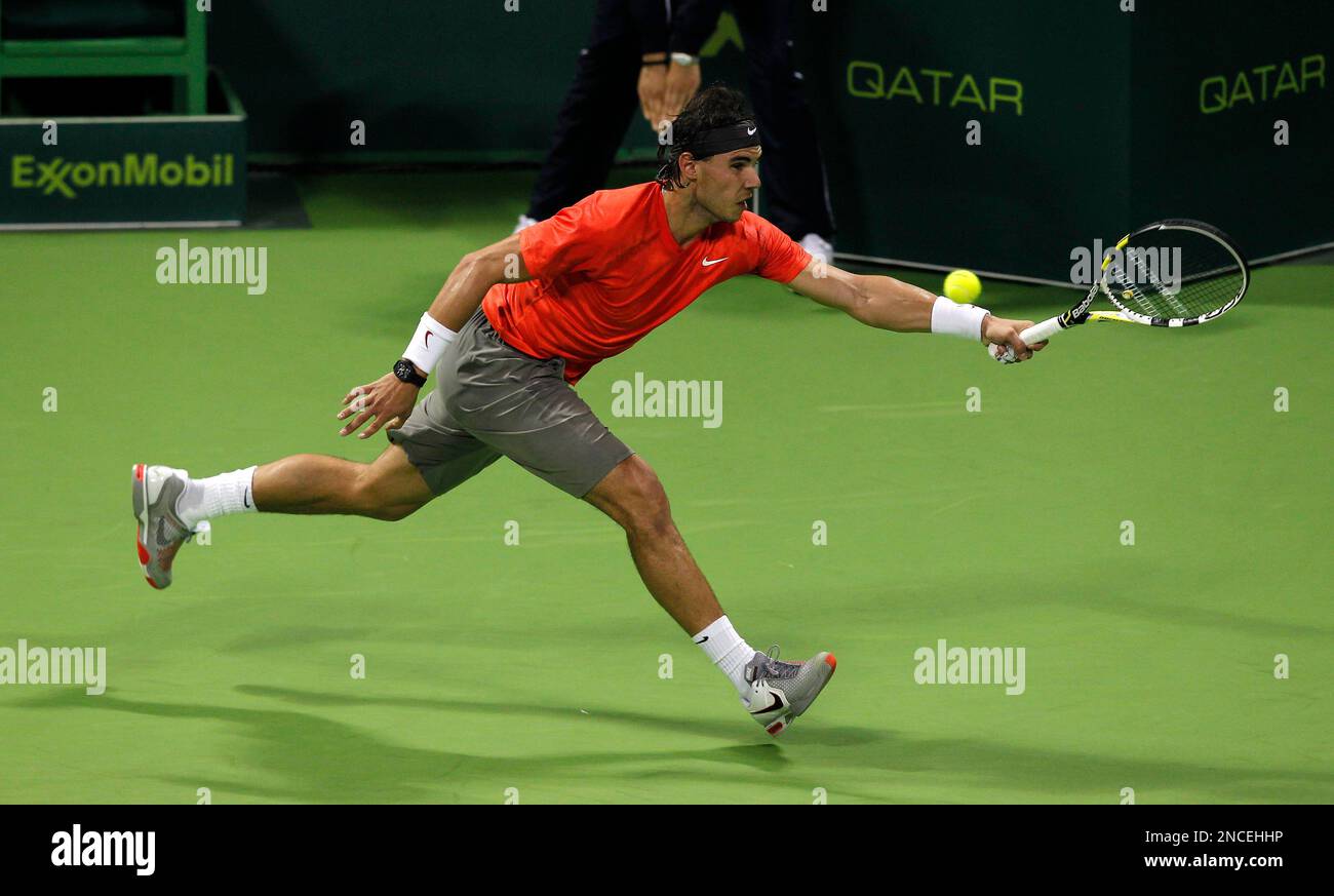 World number one tennis player Rafael Nadal of Spain returns the ball ...