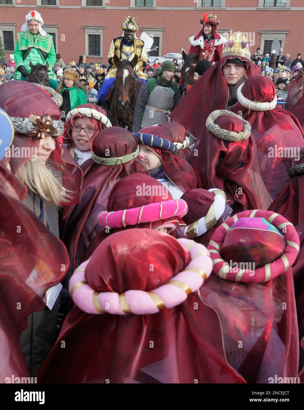 Volunteers dressed as Three Kings bring their gifts during the Epiphany ...