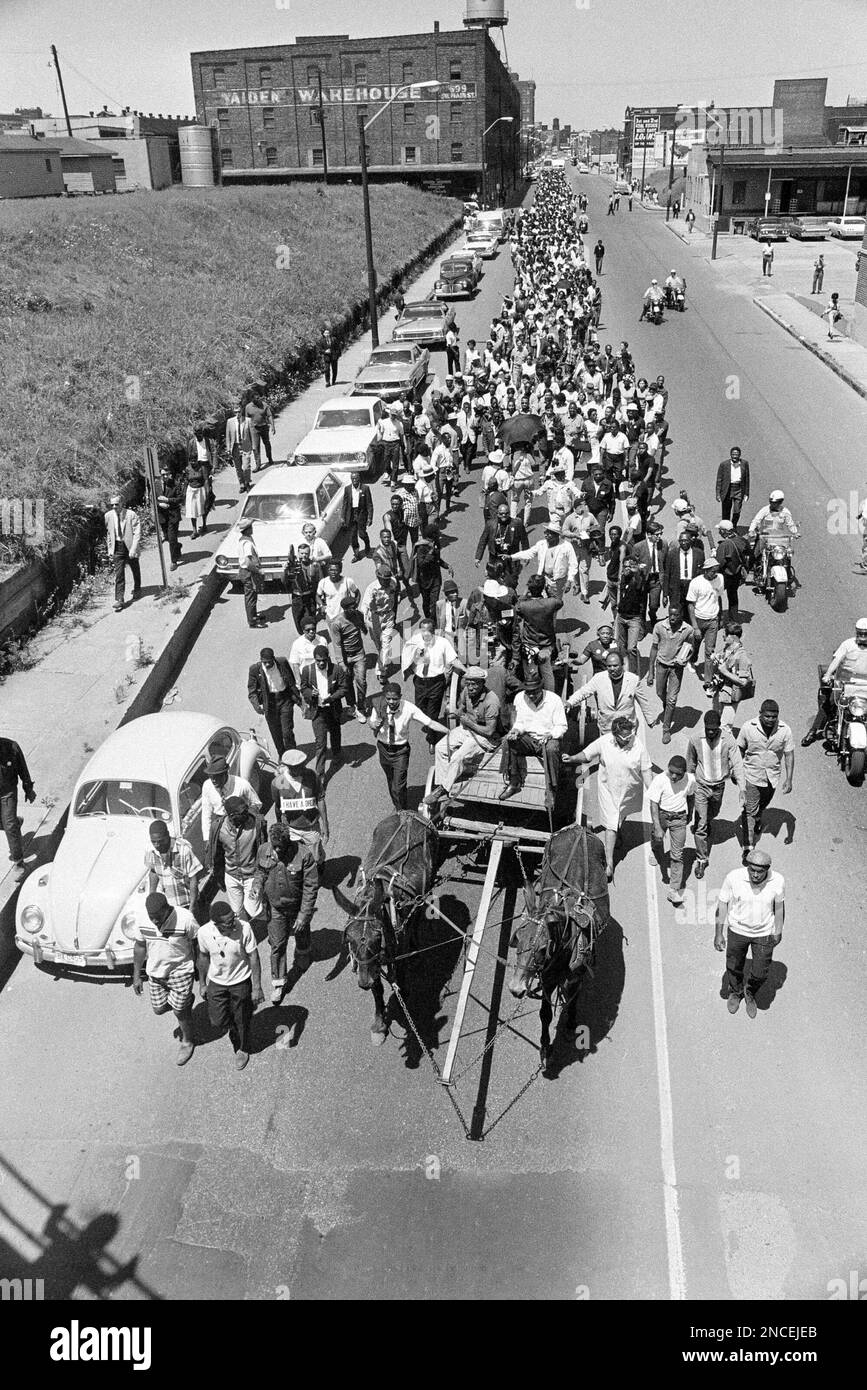The Poor People's Campaign march stretches out into the distance behind ...