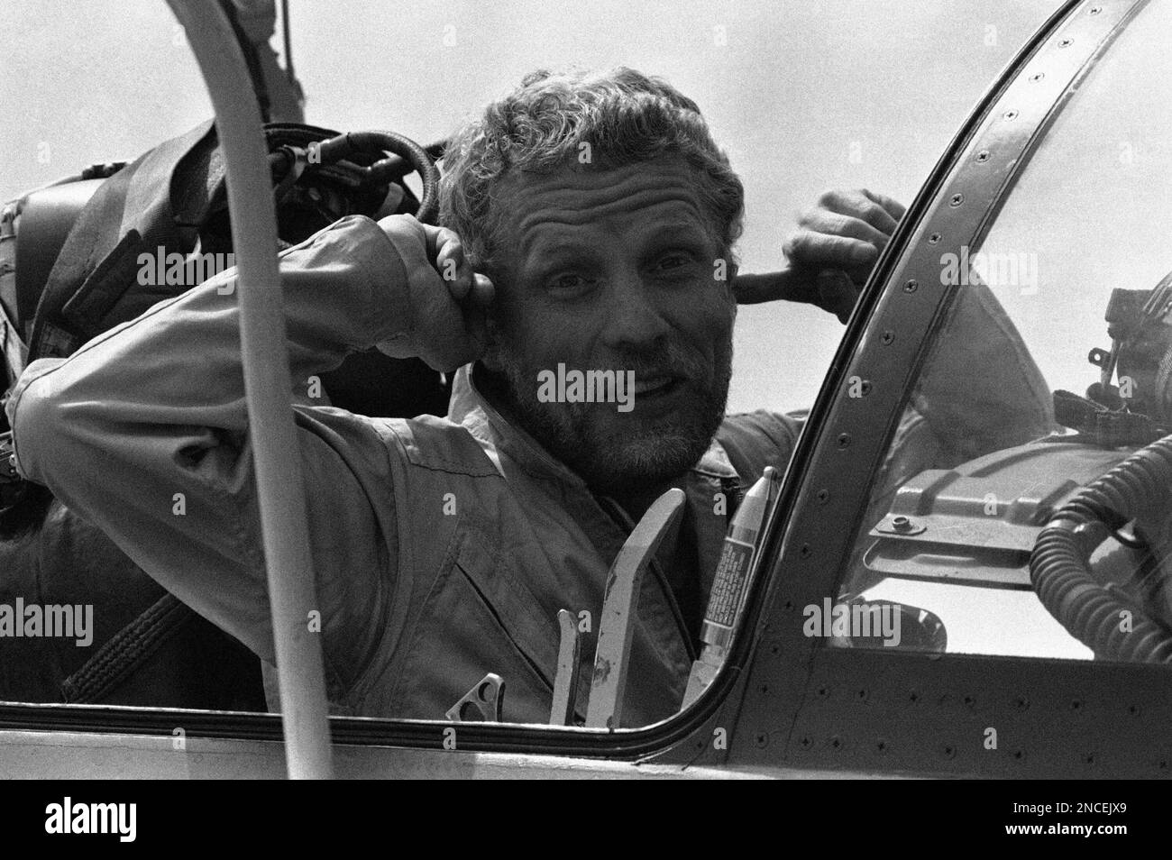 German Spacelab astronaut Reinhard Furrer plugs his ears on July 20 ...