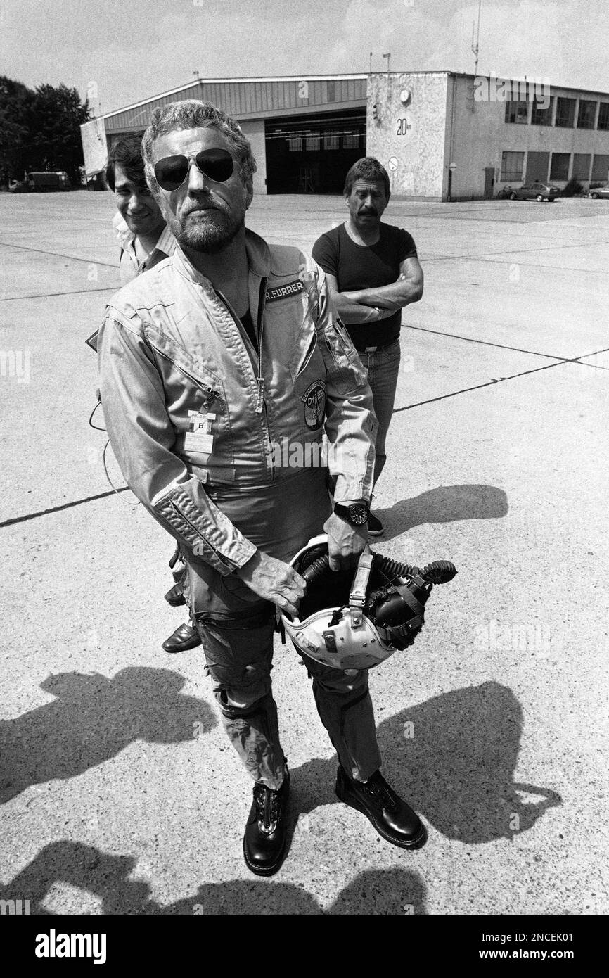 German Spacelab astronaut Reinhard Furrer holds his helmet on July 20 ...