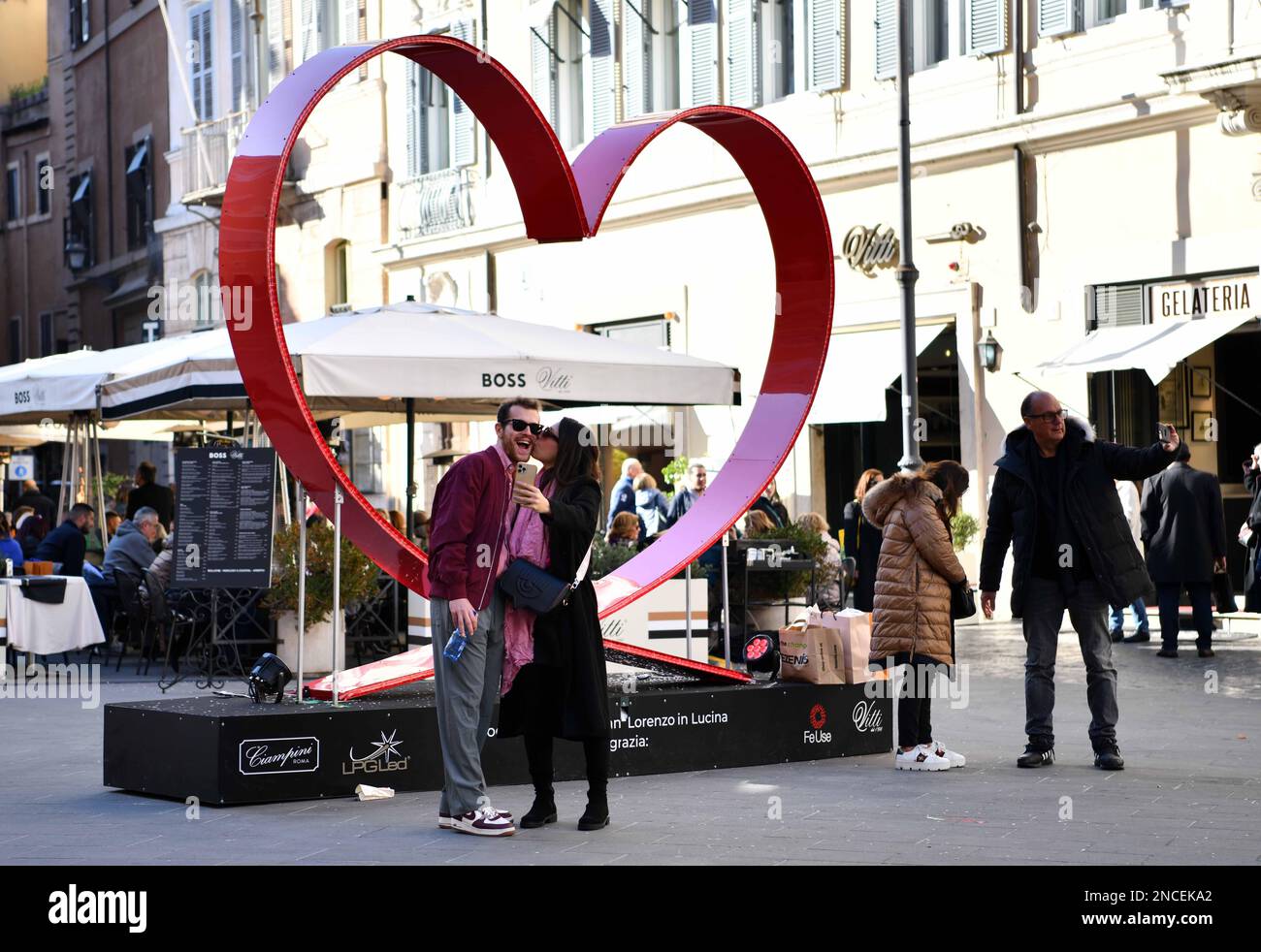 Rome, Italy. 14th Feb, 2023. A couple take a selfie in front of a heart ...