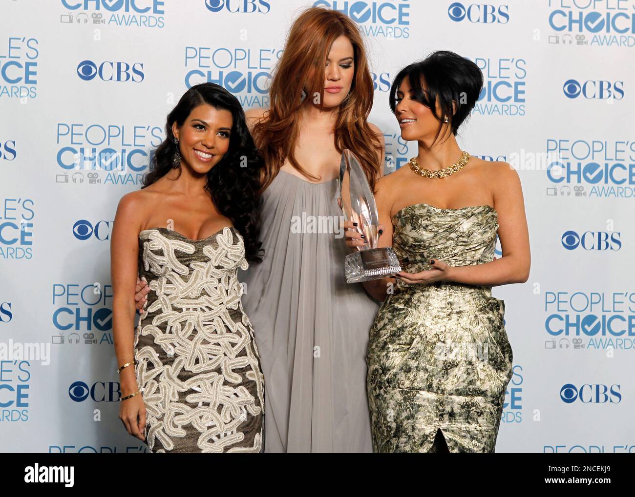 poses for a photo backstage at the People's Choice Awards on Wednesday ...