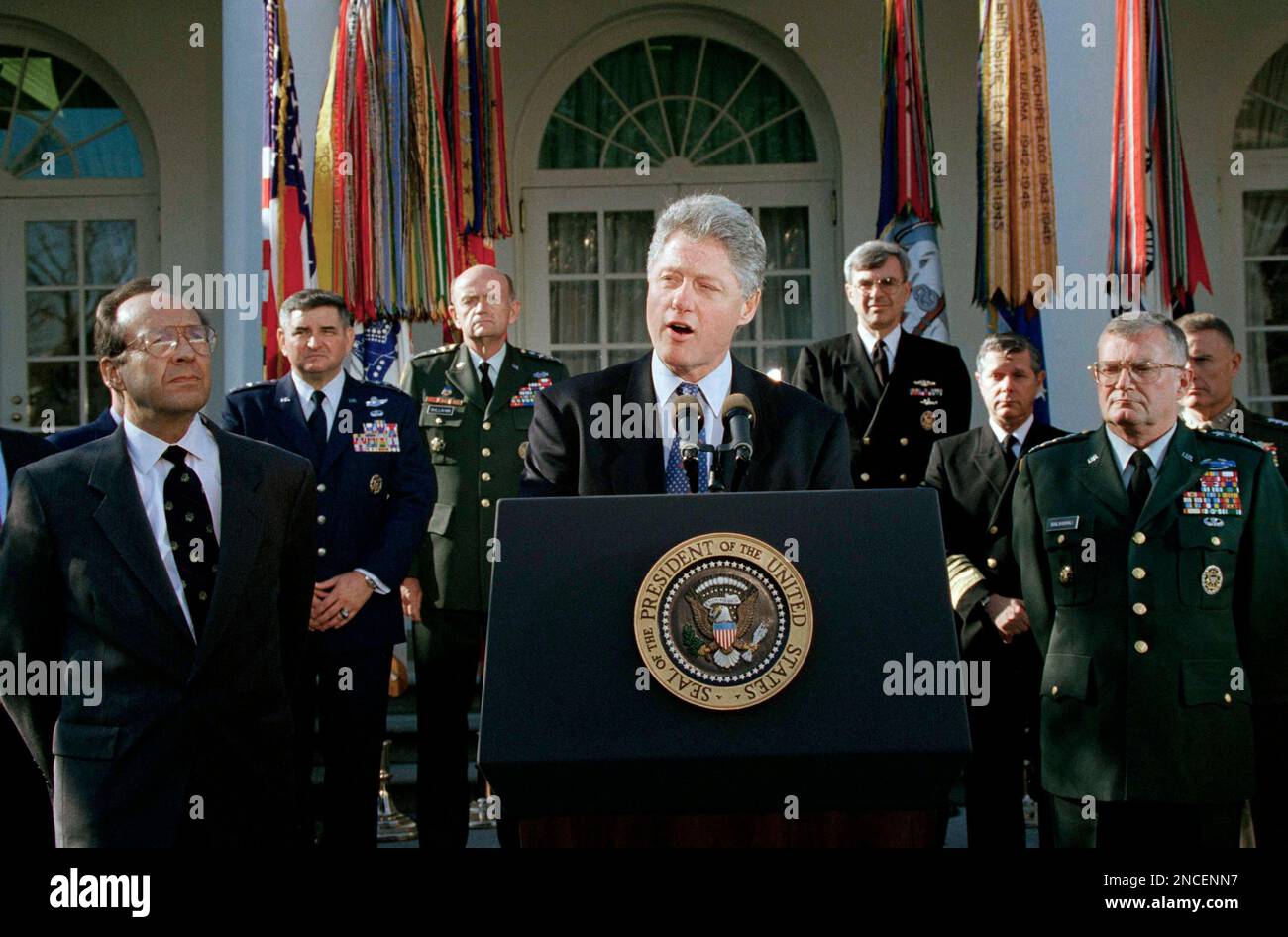 President Bill Clinton, flanked by members of his military staff ...