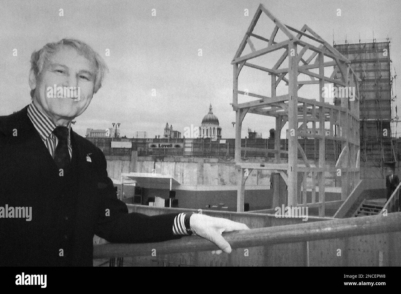 American actor-director Sam Wanamaker stands with the first structure ...