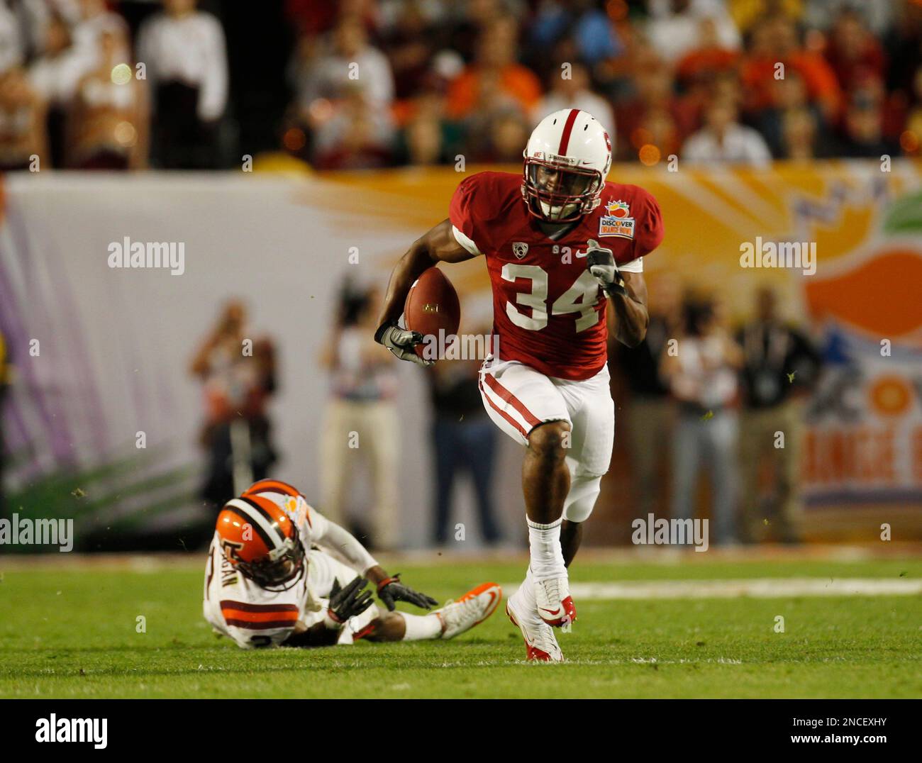 Stanford running back Jeremy Stewart (34) avoids a tackle from Virginia ...