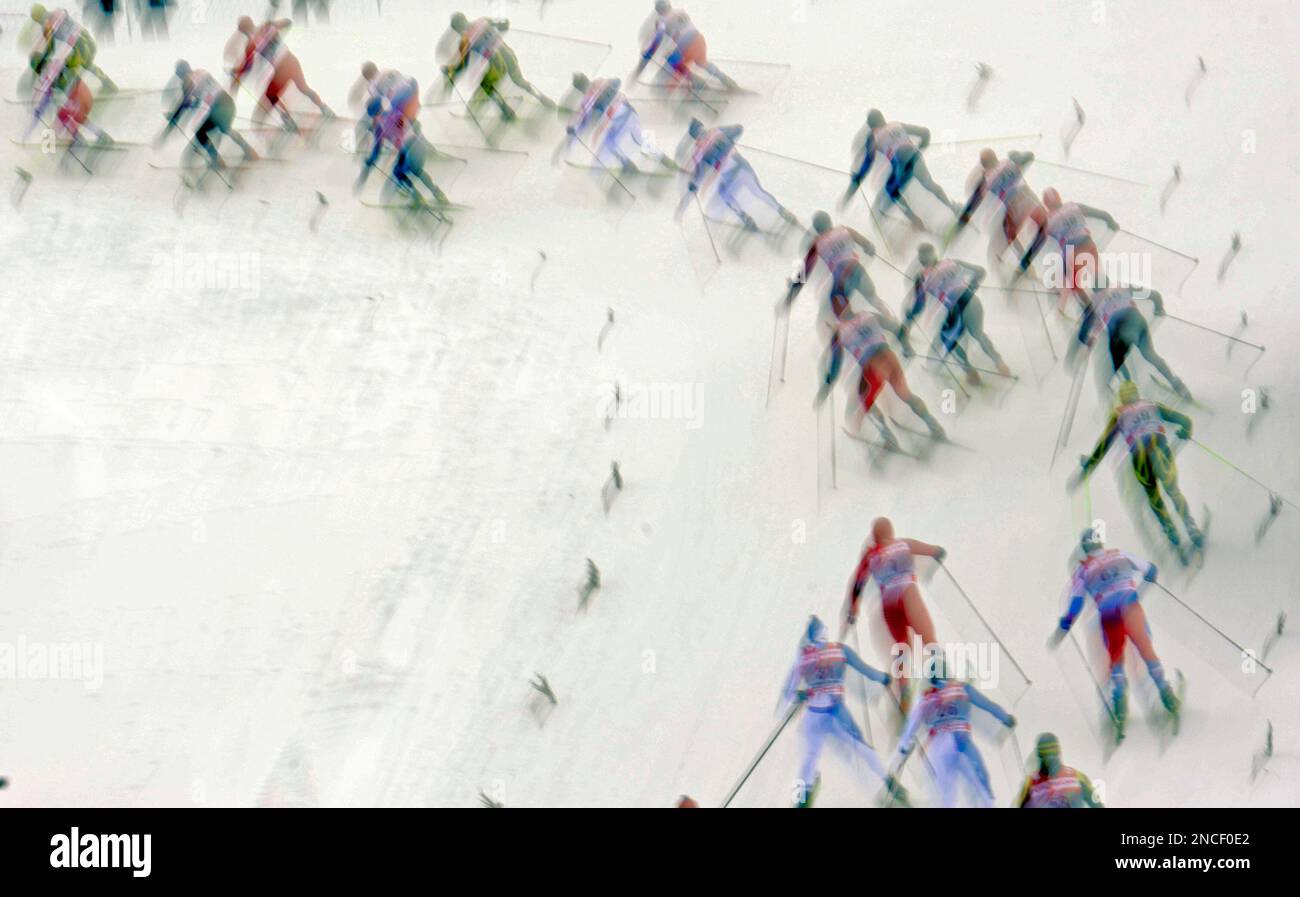 Athletes start the Men's 20 km mass start pursuit race at the cross ...