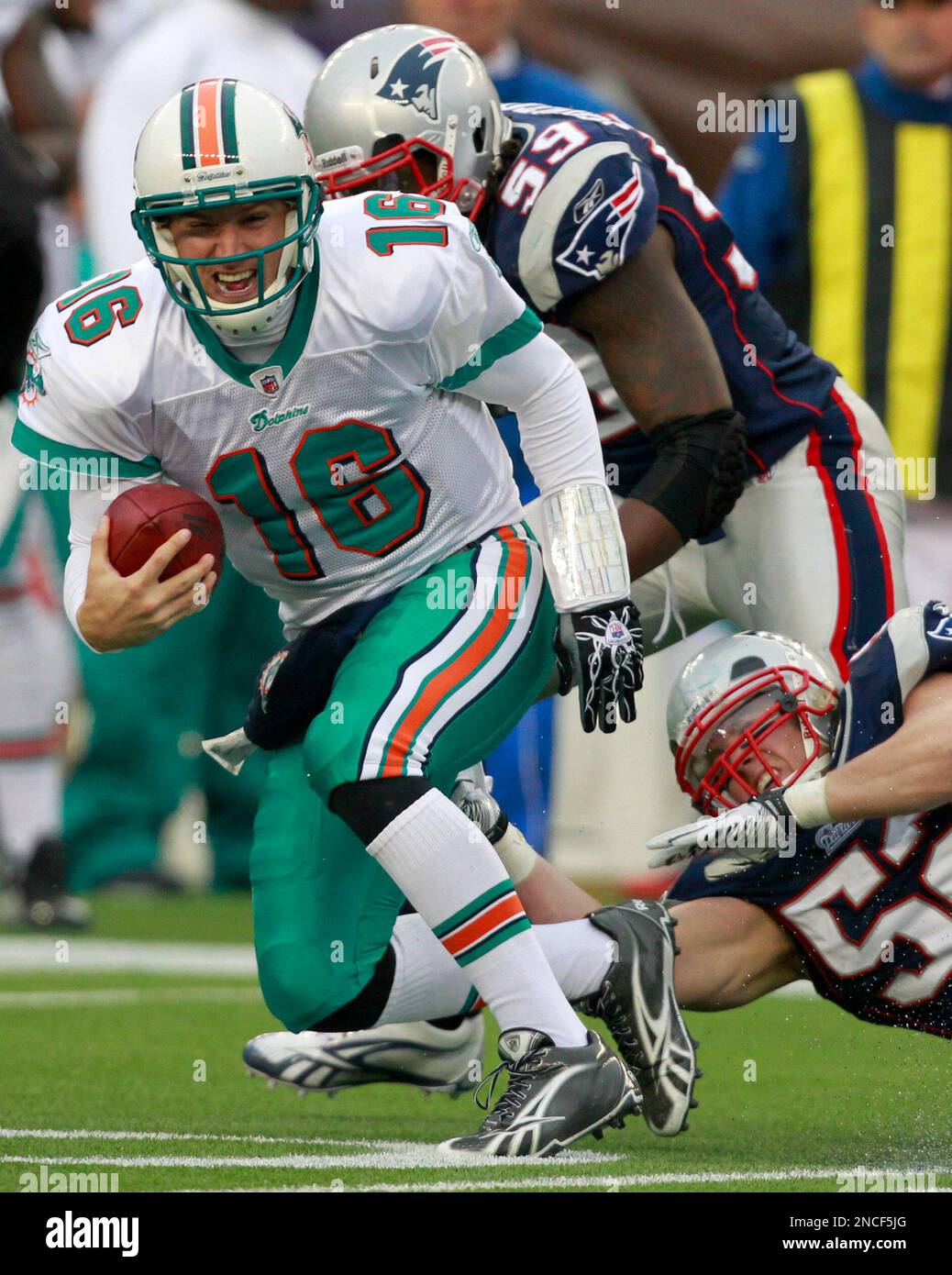 New England Patriots linebacker Dane Fletcher, lower right, tackles ...