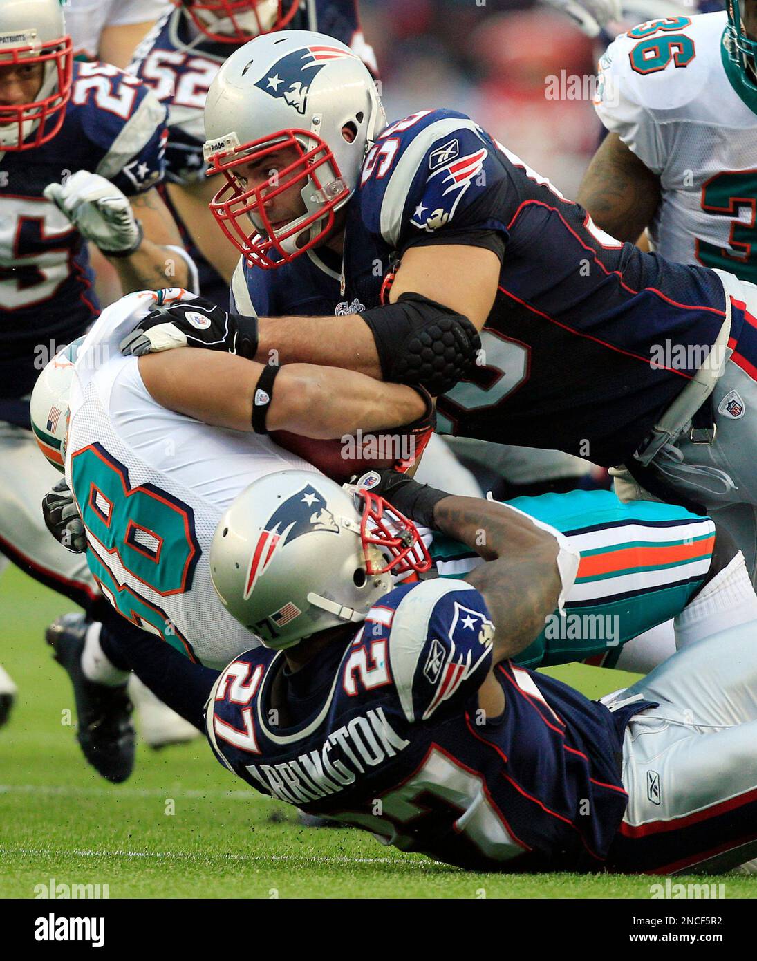New England Patriots linebacker Rob Ninkovich, top, levels Miami ...