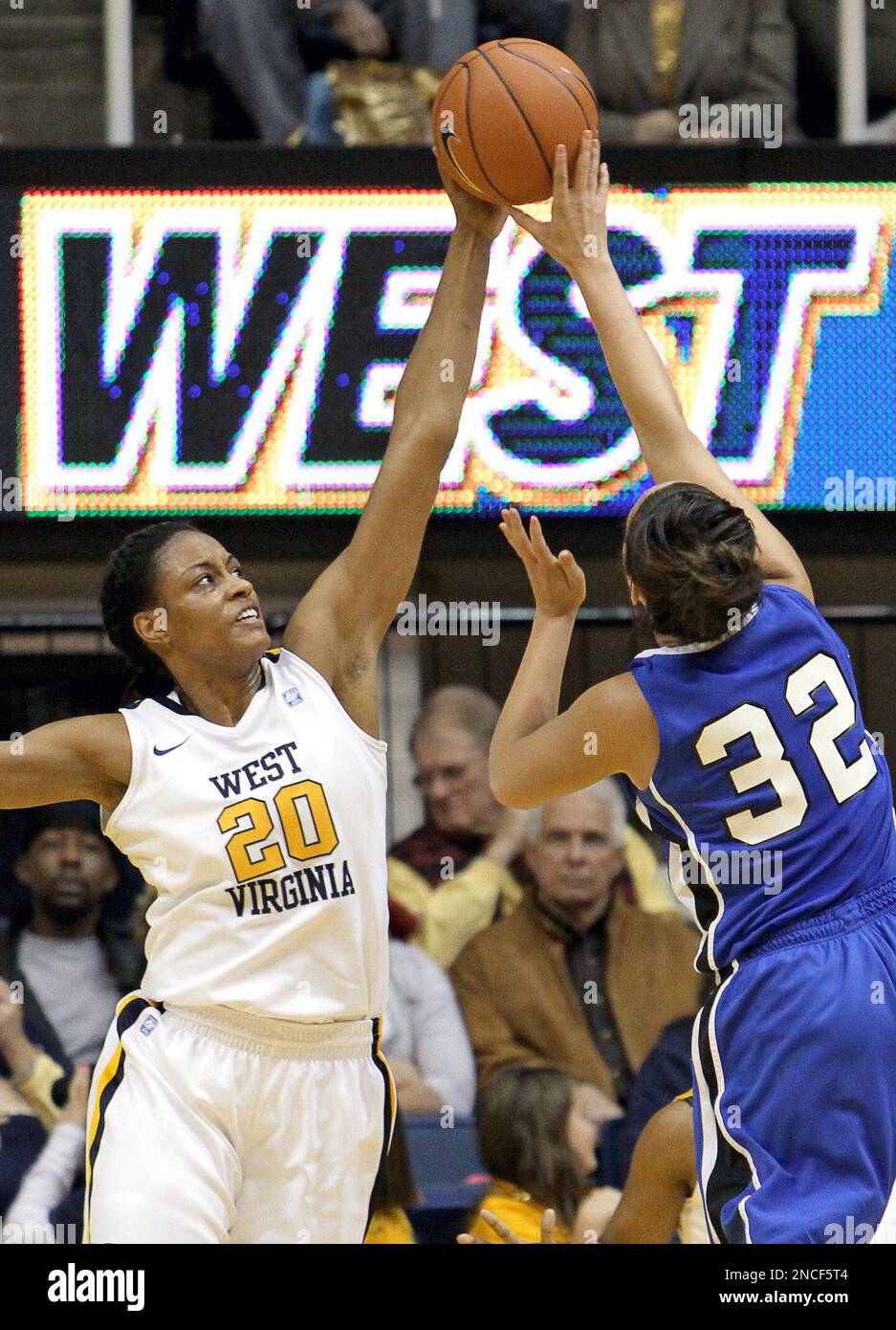 West Virginia's Asya Bussie (20) blocks the shot of Central Connecticut ...