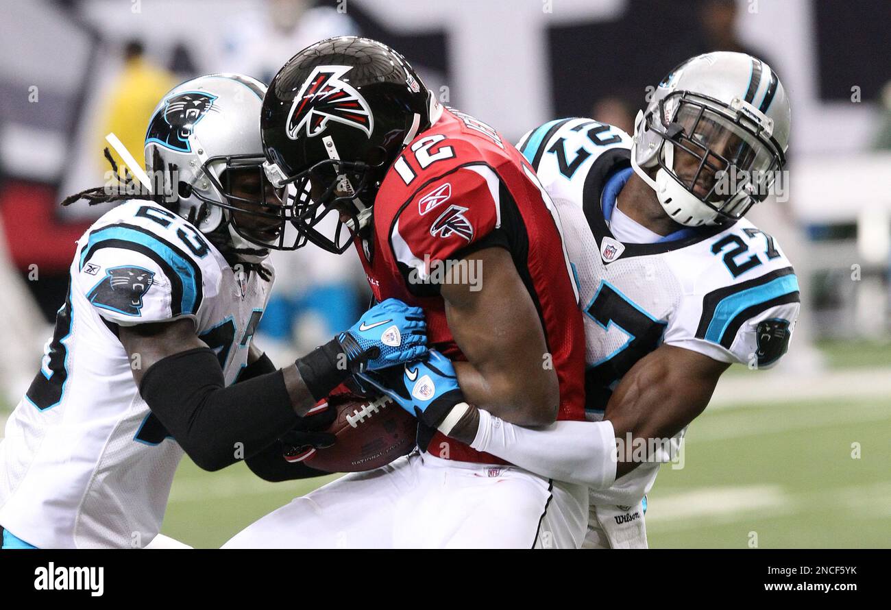 Carolina Panthers defenders Sherrod Martin (23) and C.J. Wilson (27 ...
