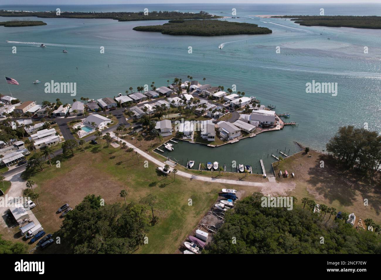 Small waterfront villas aerial photo looking out the pass to the Gulf ...