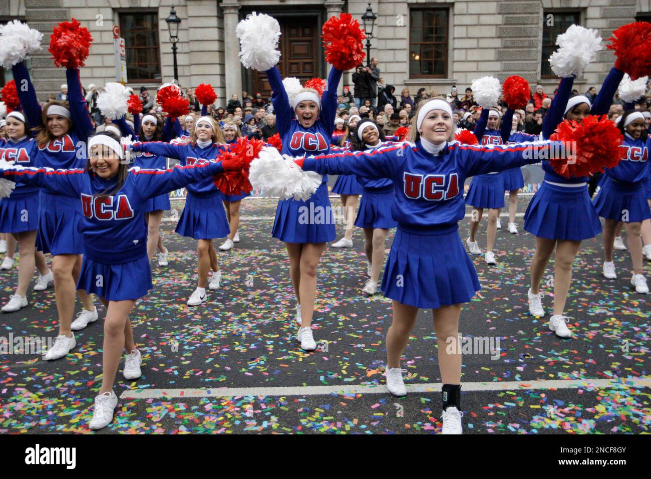 Members of Universal Cheerleaders Association perform as they parade ...