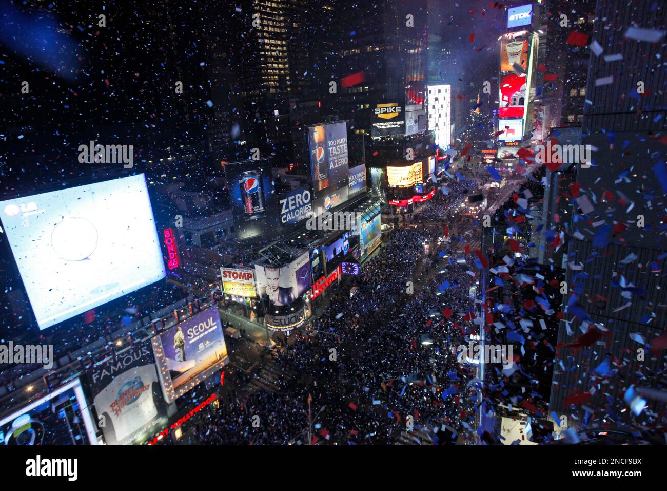 Confetti flies over New York's Times Square during the New Year's Eve ...