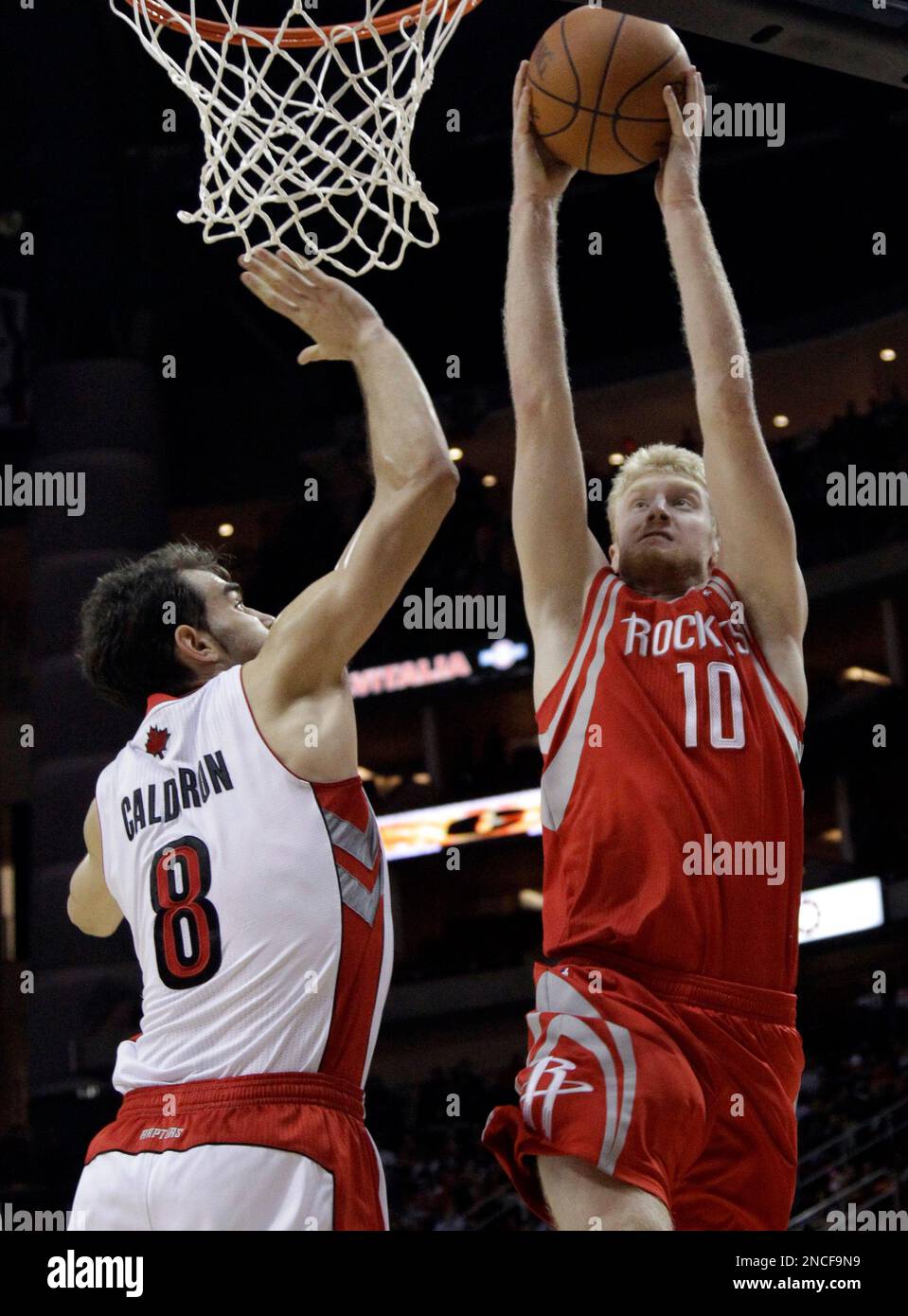 Houston Rockets' Chase Budinger (10) shoots over Toronto Raptors' Jose ...
